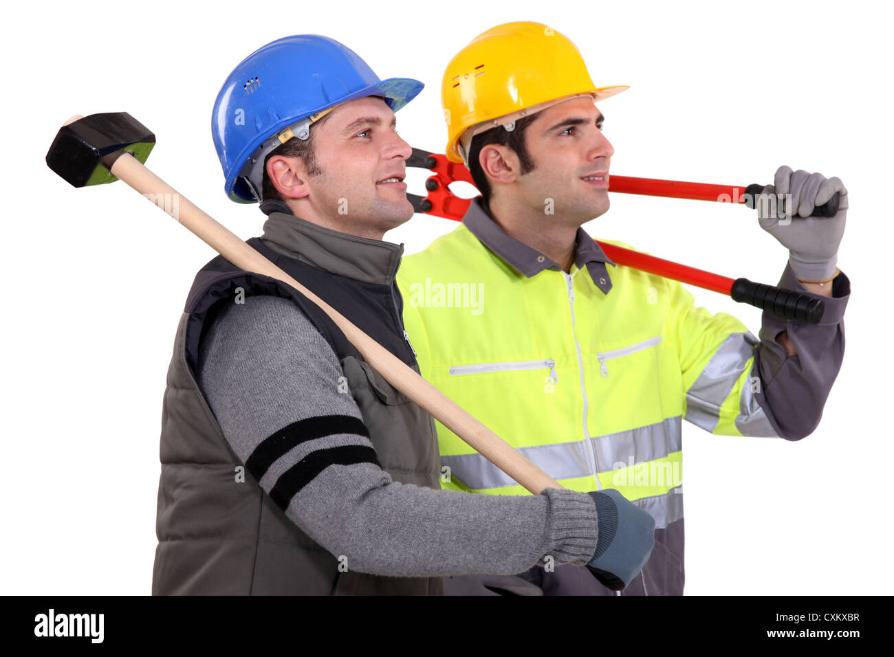 Two manual workers stood together looking into the distance Stock Photo ...