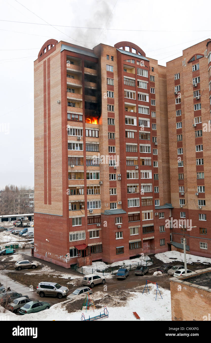 Fire in one of the apartments of a large tenement-house Stock Photo - Alamy