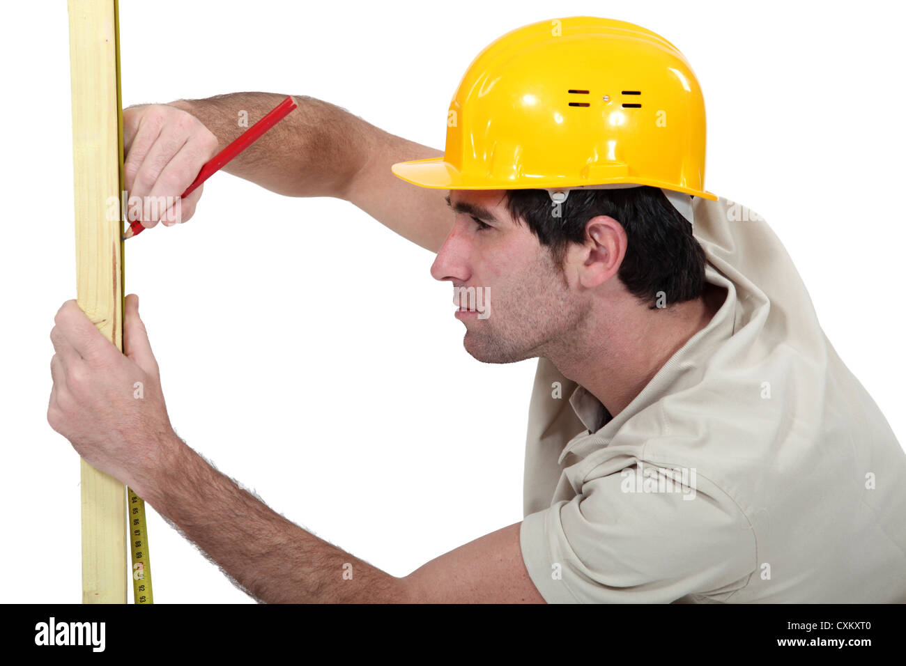 Carpenter marking plank Stock Photo - Alamy