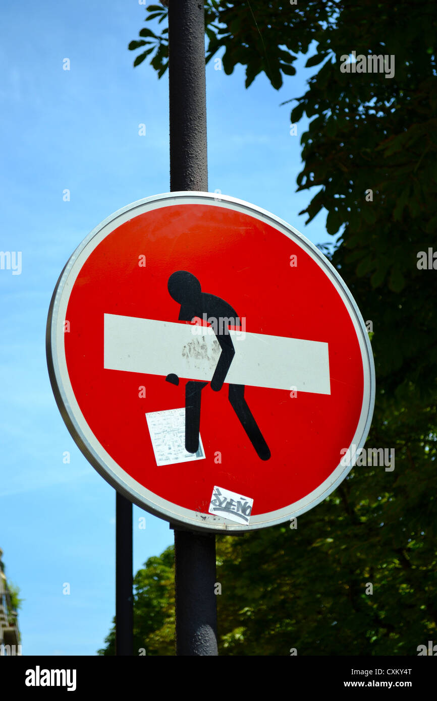 A humourous piece of graffiti in Paris changes a 'No Entry' sign into a ...