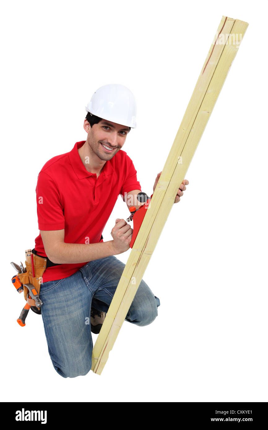 Man cutting wood board Cut Out Stock Images & Pictures - Alamy