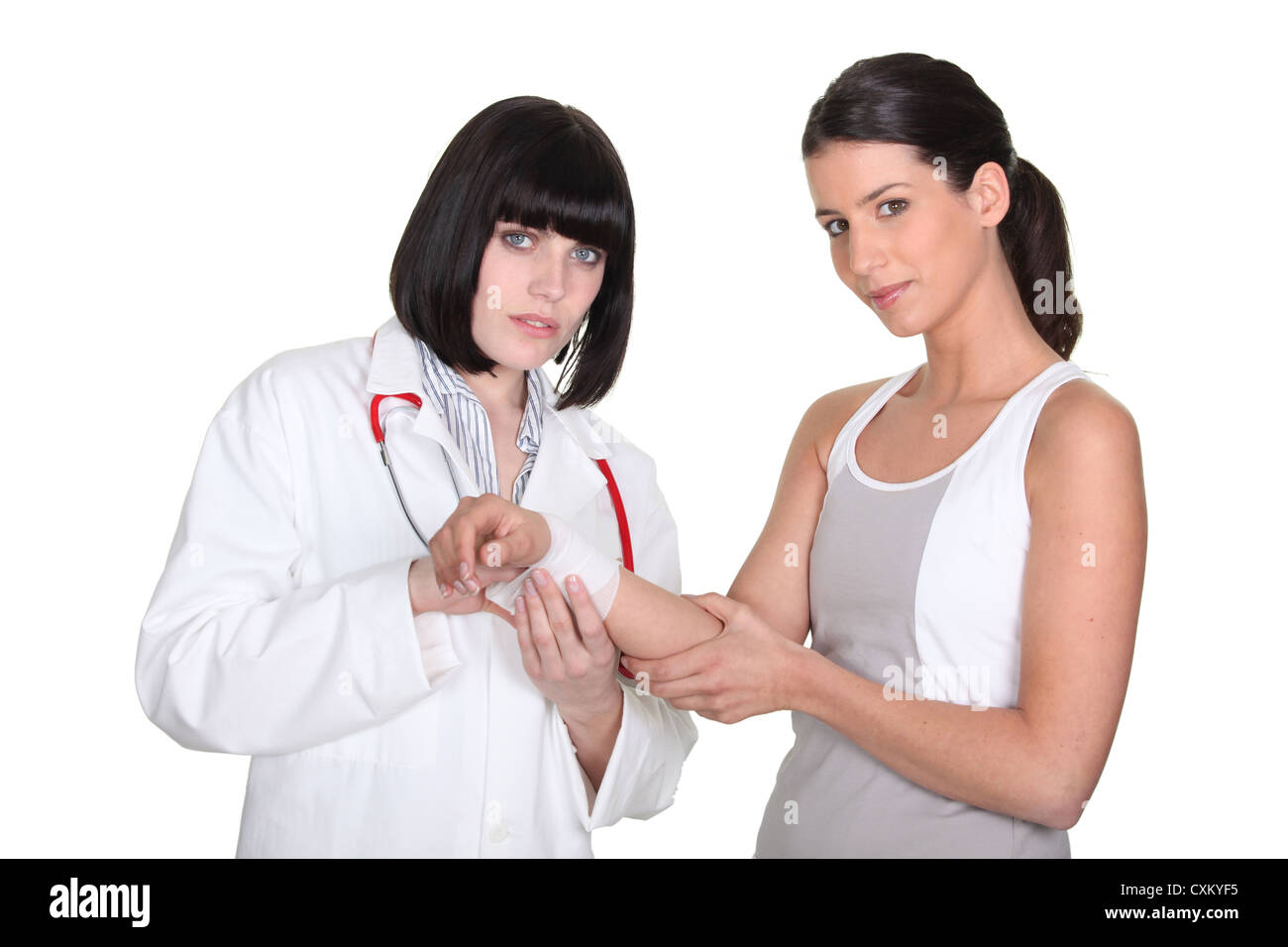 Doctor listening female patient Cut Out Stock Images & Pictures - Alamy