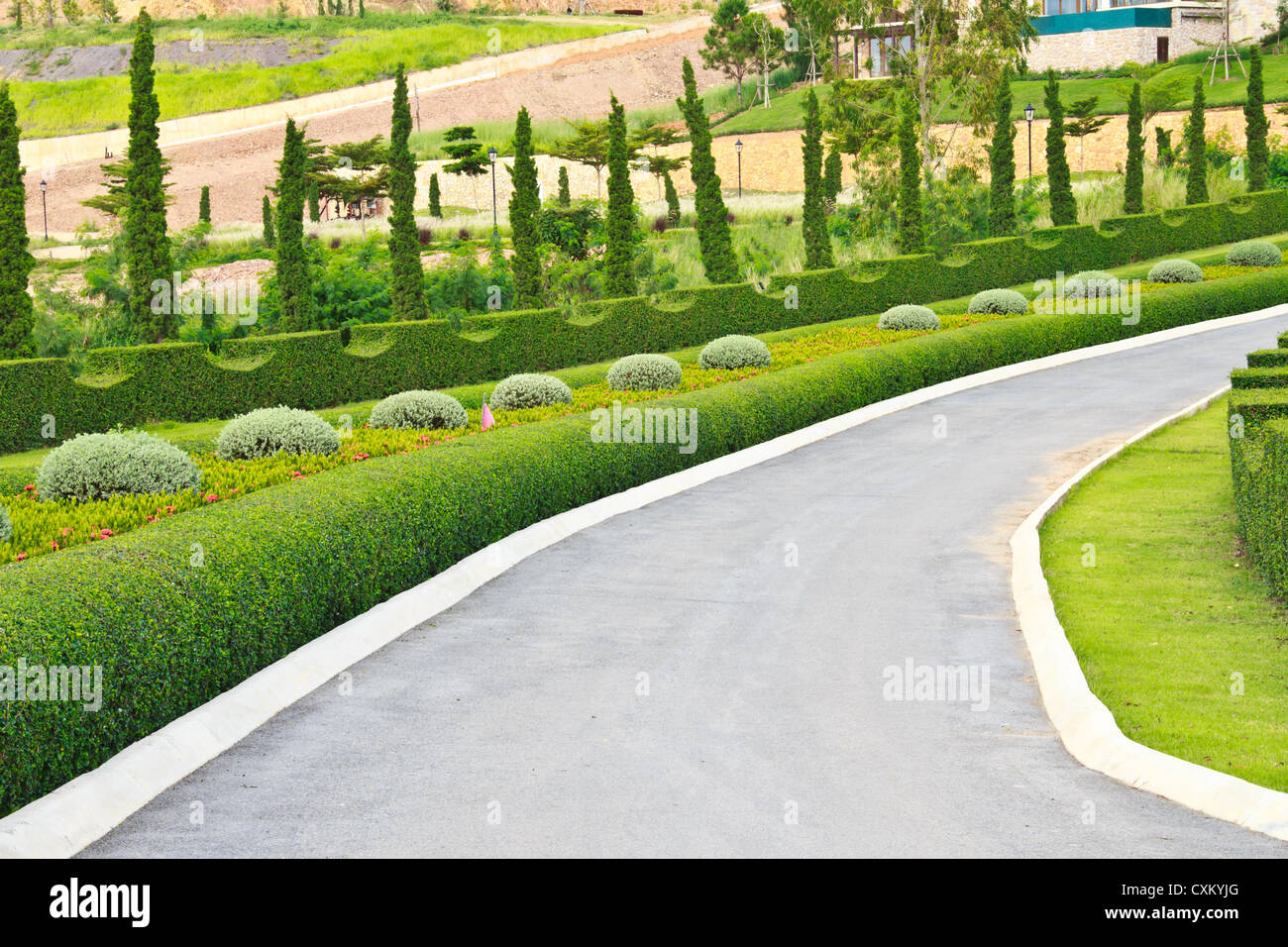 Beautiful garden beside the walkway in golf course Stock Photo - Alamy