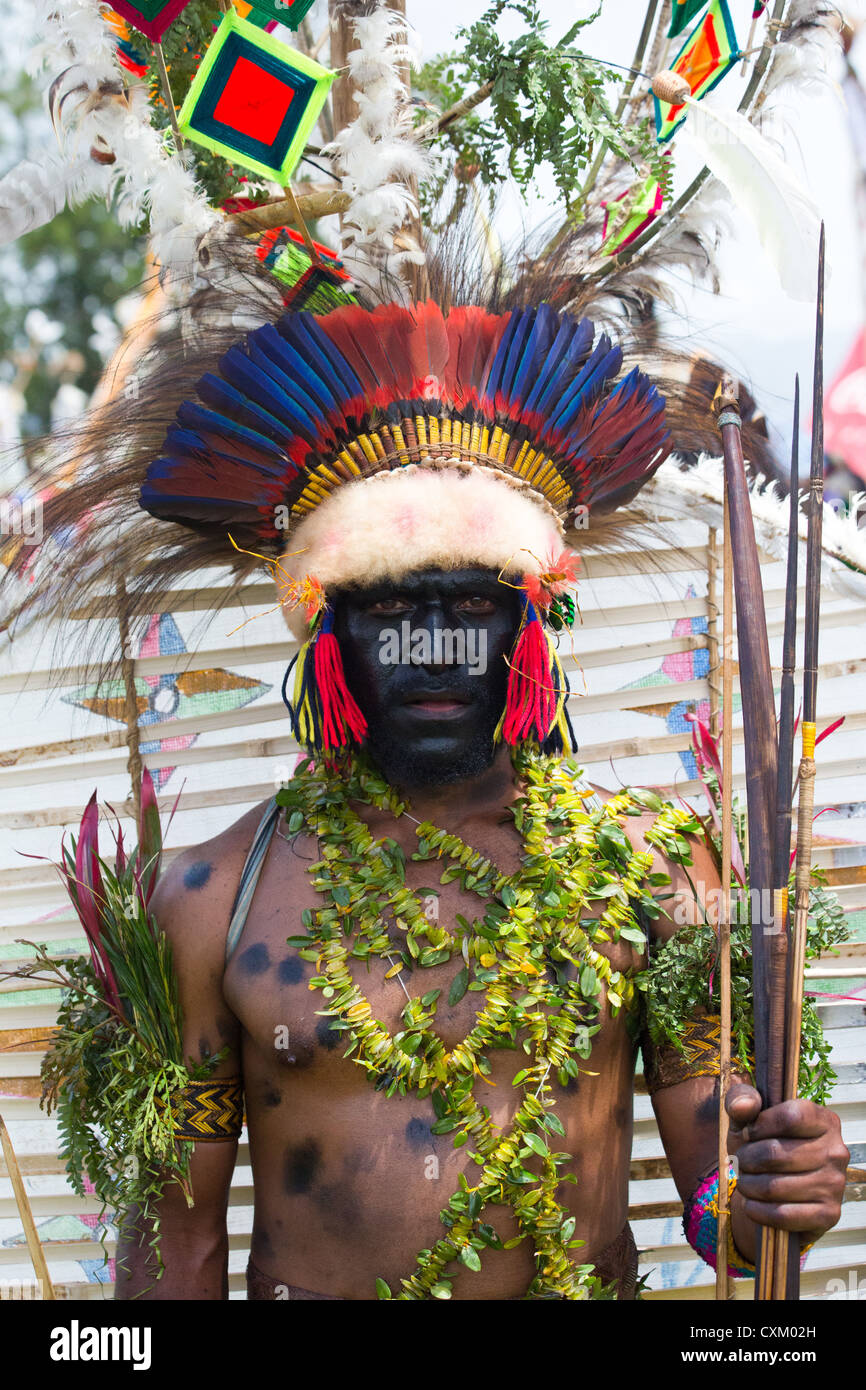 Portrait of a man dressed in traditional tribal outfit for the Goroka ...