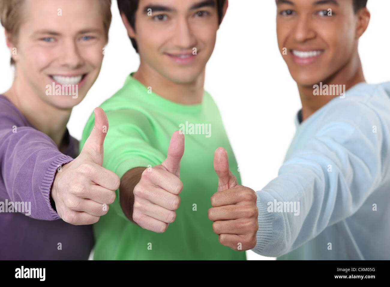 Thumbs up from three lads Stock Photo - Alamy