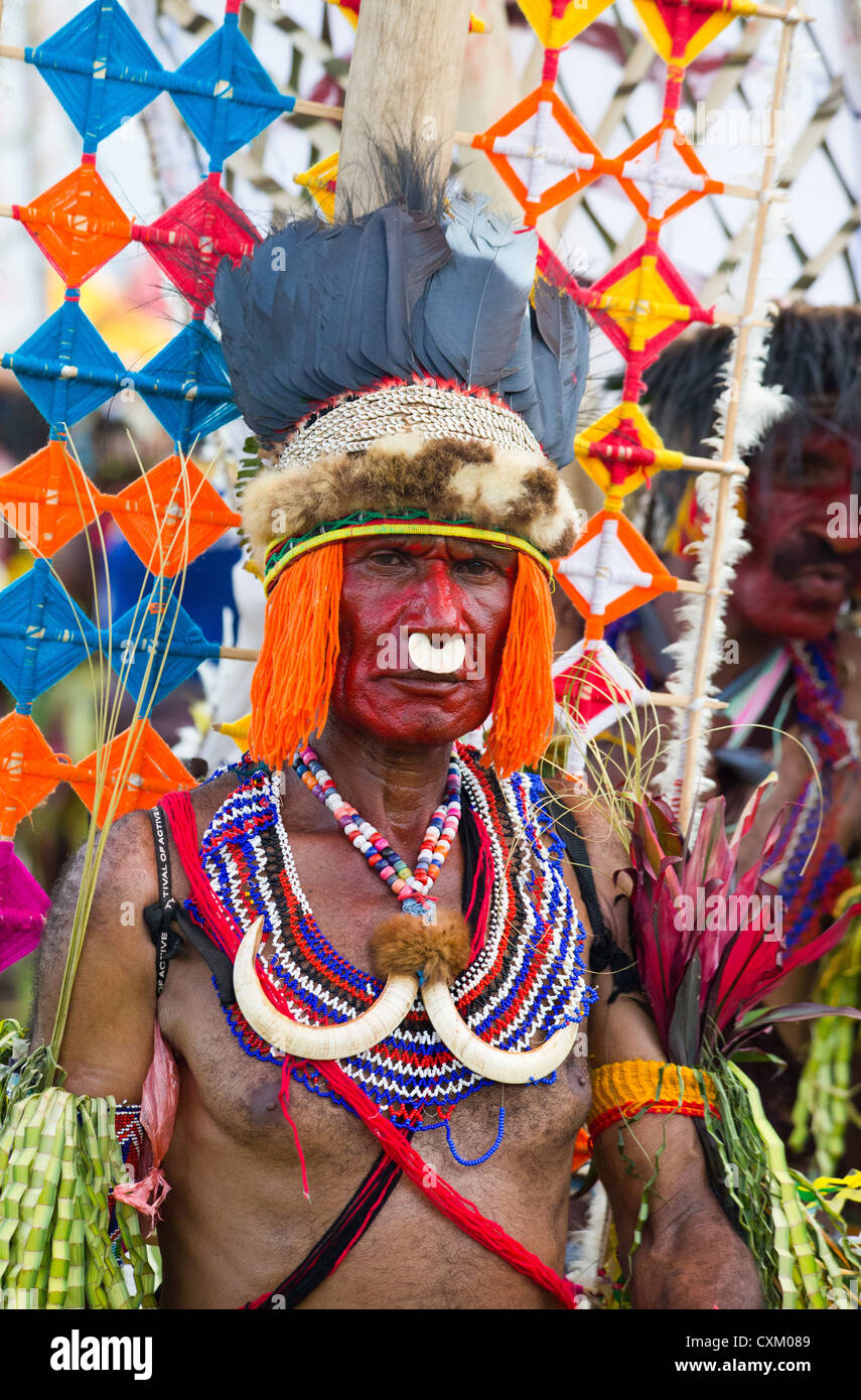 Portrait of a man dressed in traditional tribal outfit for the Goroka ...