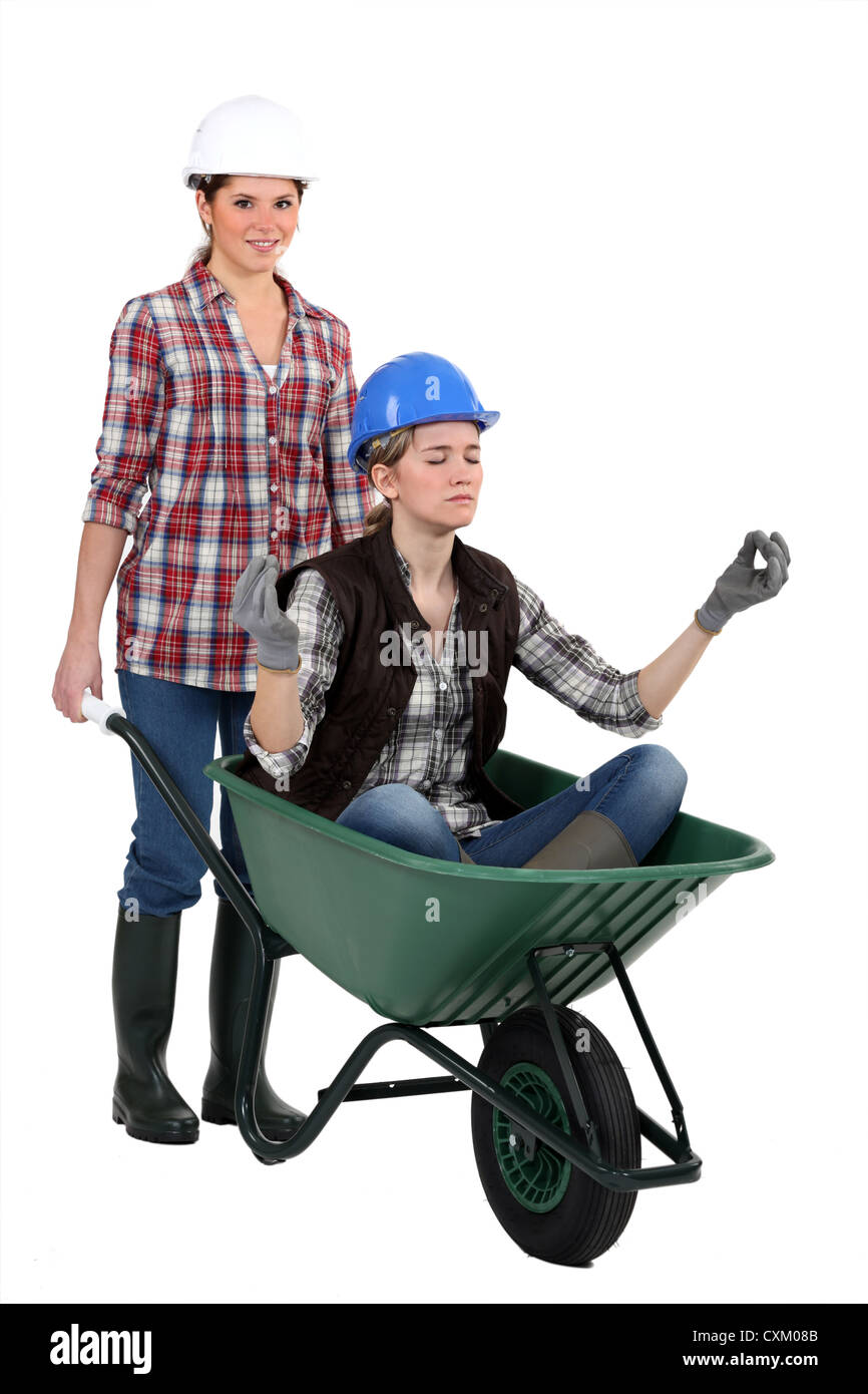Young women laborers with a wheelbarrow Stock Photo - Alamy