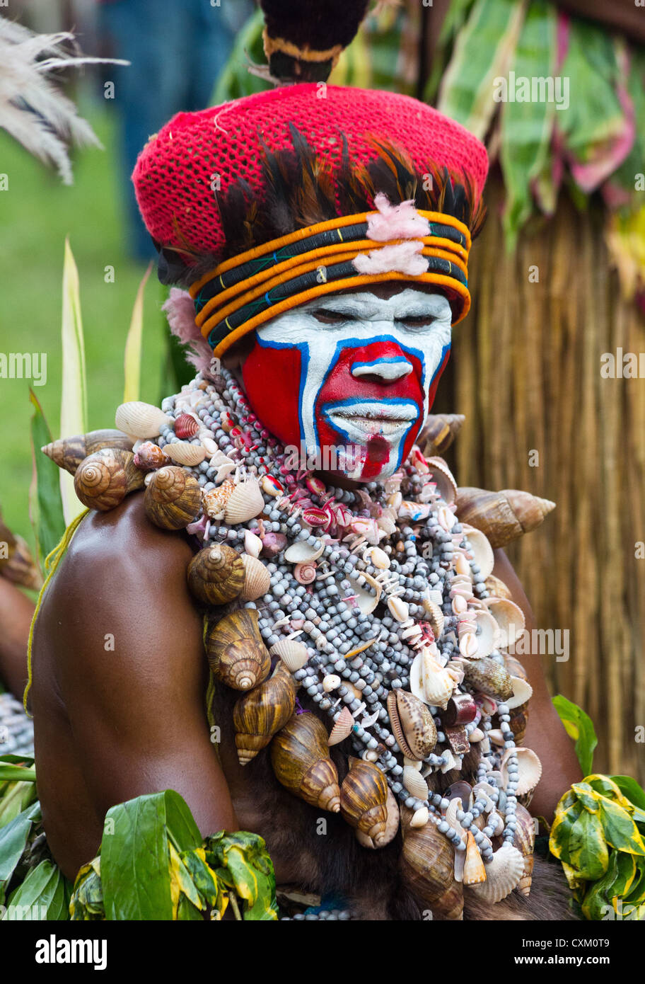 Woman dressed in traditional tribal costume and headdress at the ...