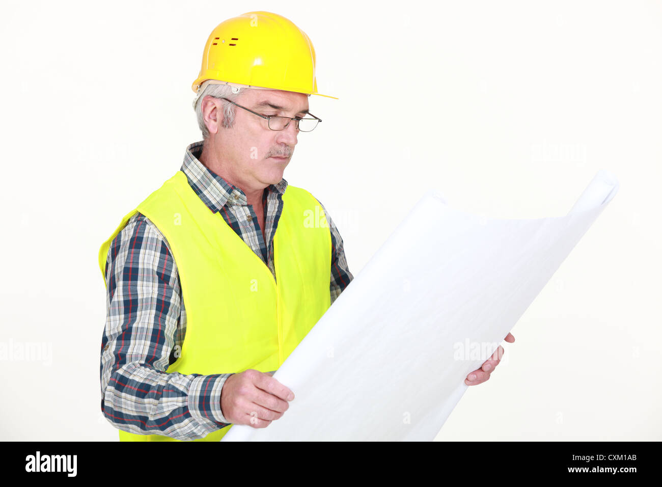 Engineer foreman reviewing blueprints hi-res stock photography and ...