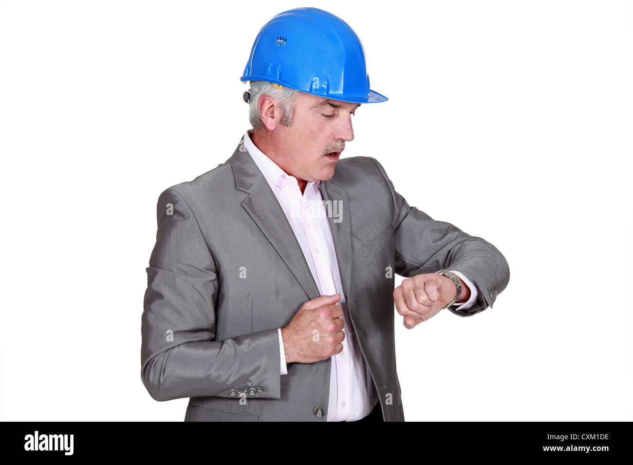 Confused businessman looking watch hi-res stock photography and images ...