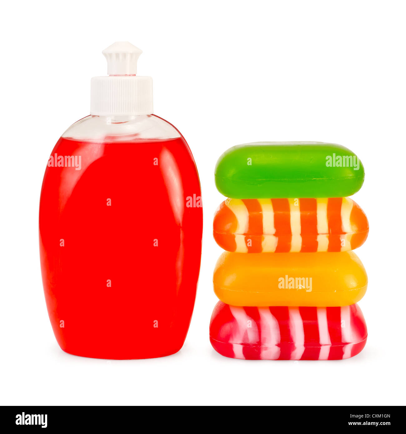 Red liquid soap in a bottle, a stack of solid red, green, yellow and ...