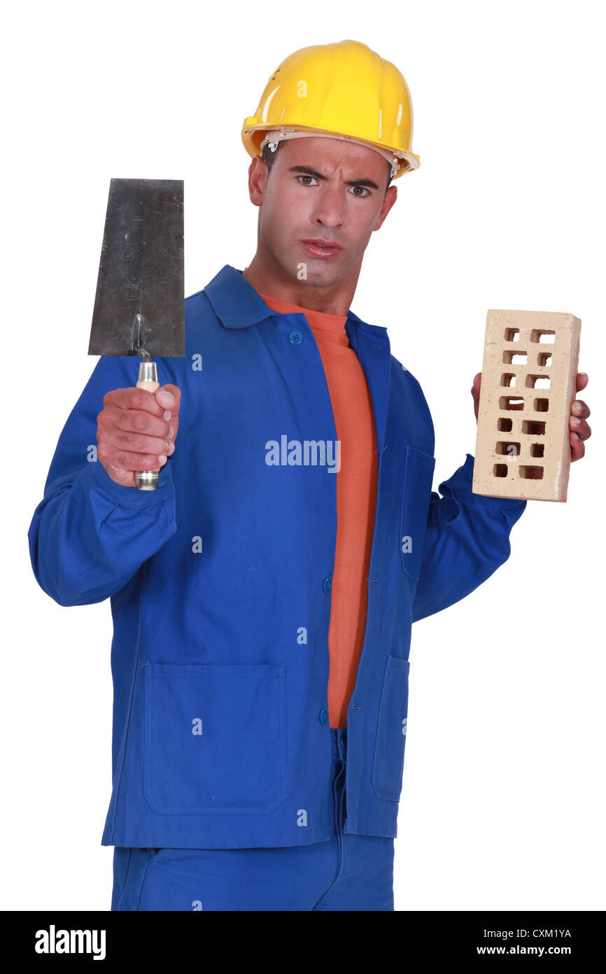Angry tradesman holding brick trowel hi-res stock photography and ...