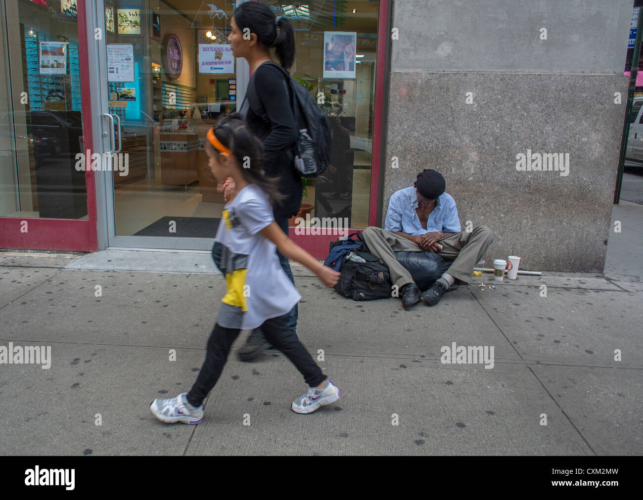 Homeless girl sidewalk manhattan hi-res stock photography and images ...