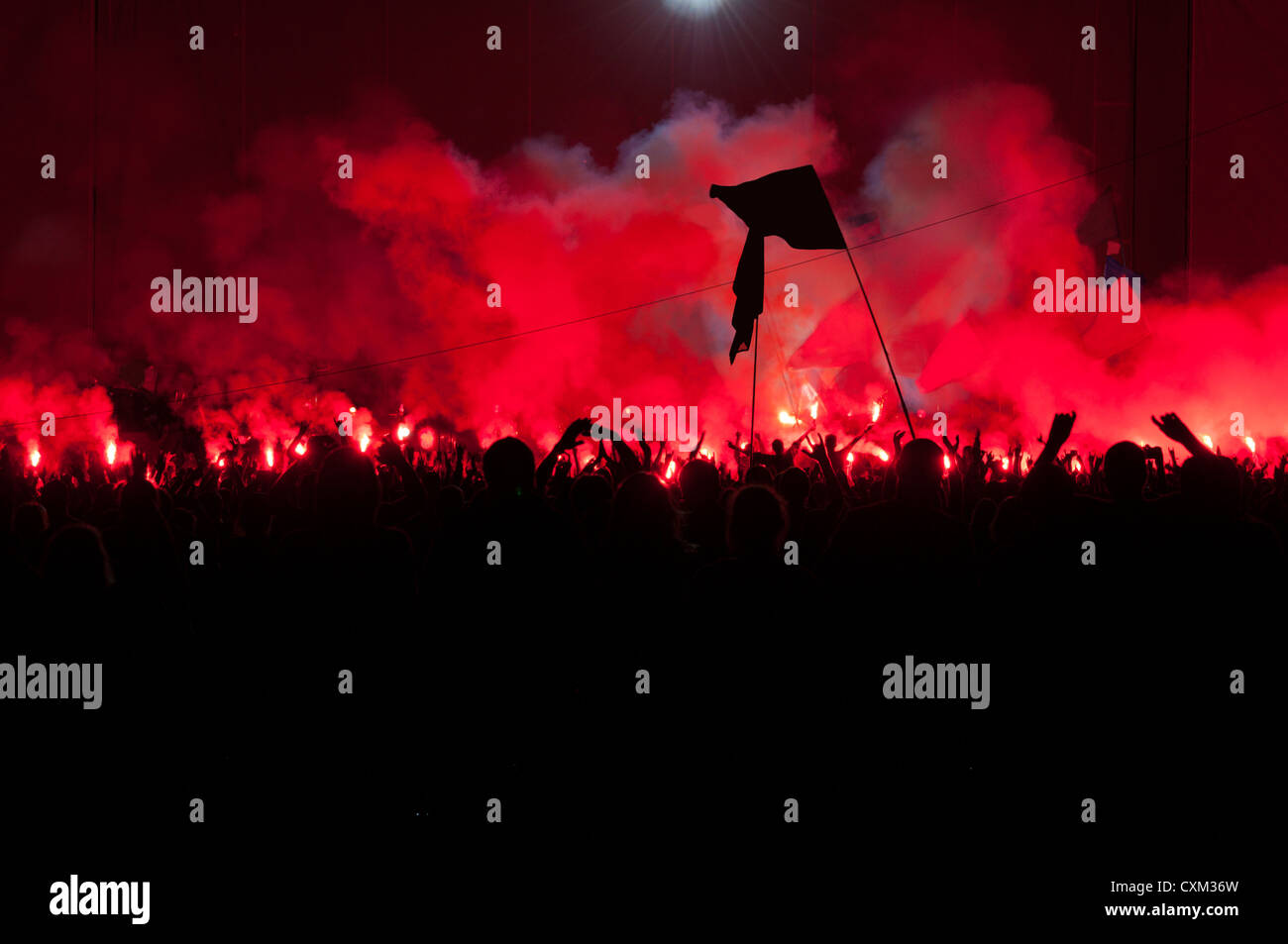 Red smoke flares hi-res stock photography and images - Alamy