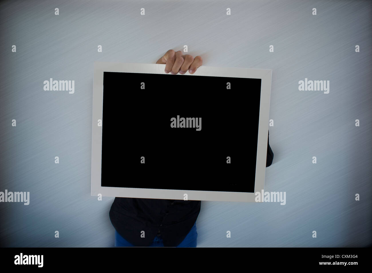 Man holding an empty sign Stock Photo - Alamy
