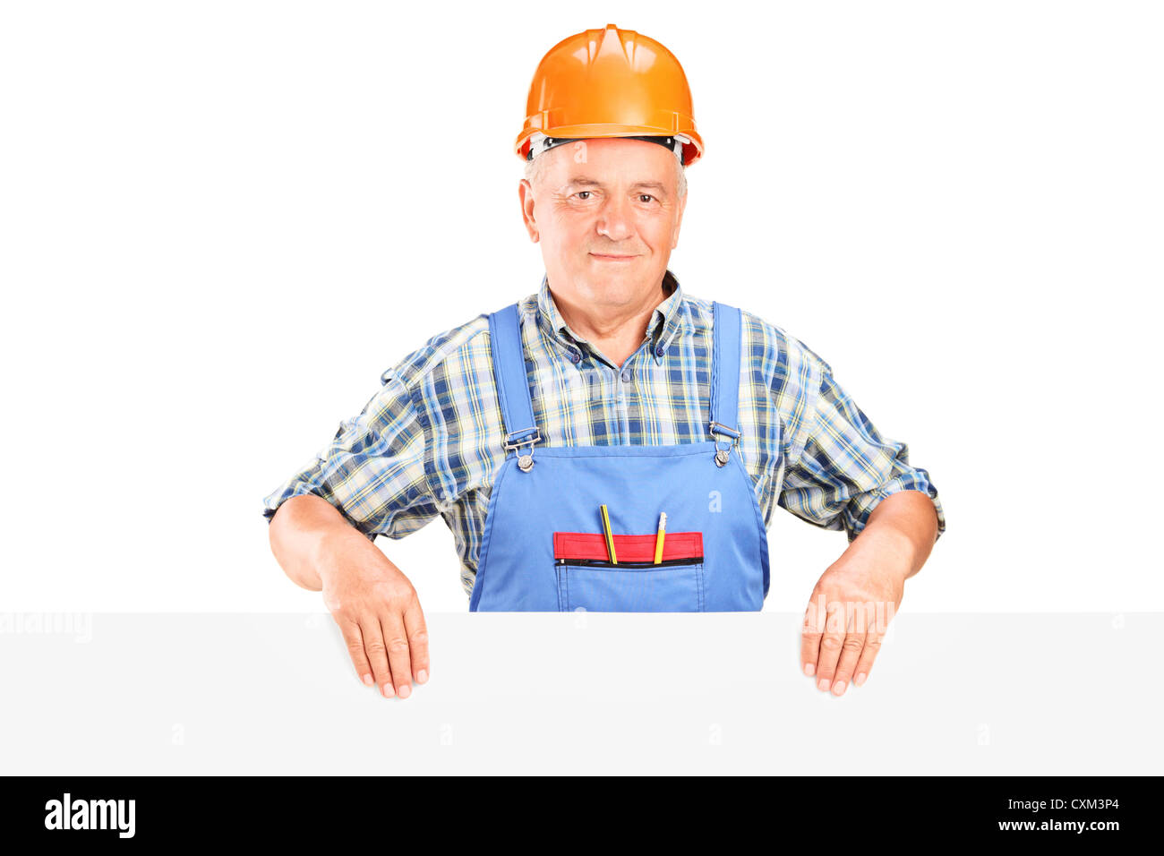 A male construction worker holding a panel isolated on white background ...