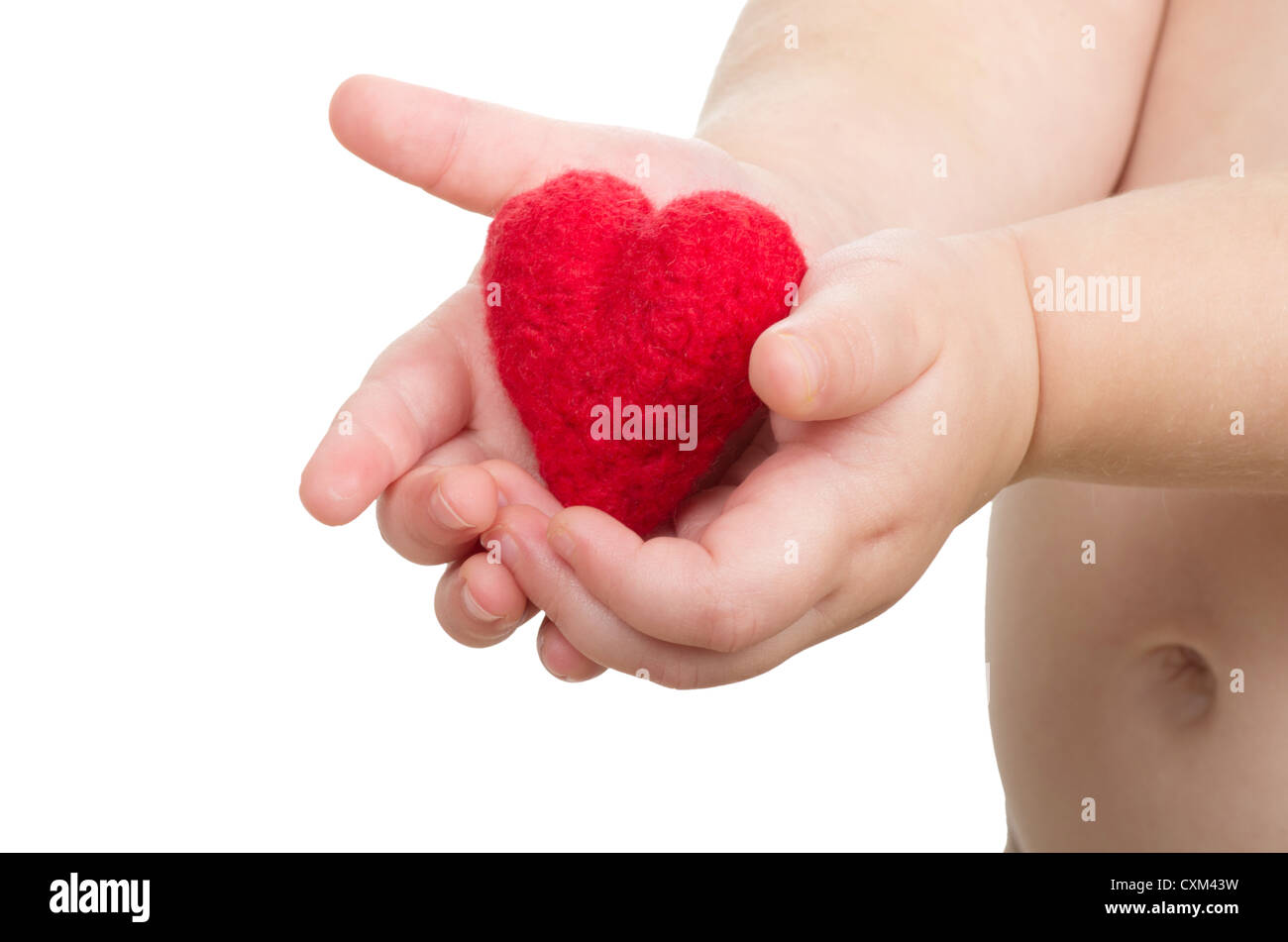Child's hands with a red heart Stock Photo - Alamy
