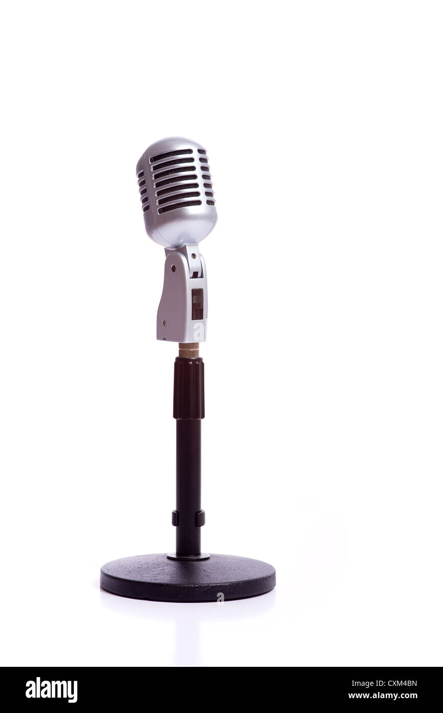 A vintage looking microphone on a white background with copy space ...