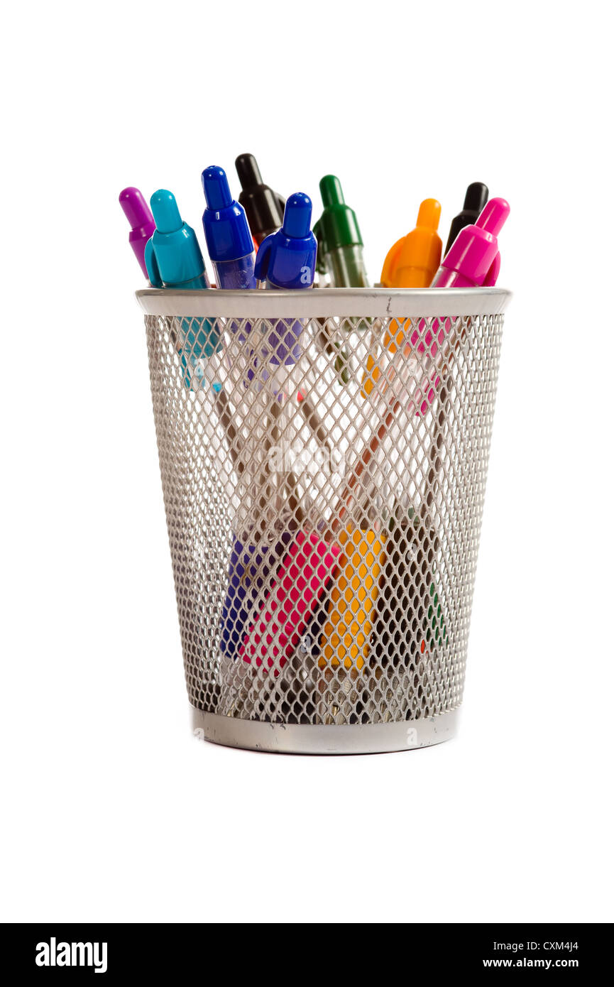 a background of desk top pen holder full of brightly colored pens on a ...