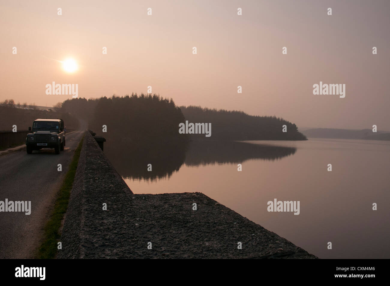 Beautiful evening light at sunset over calm water of quiet rural scenic ...