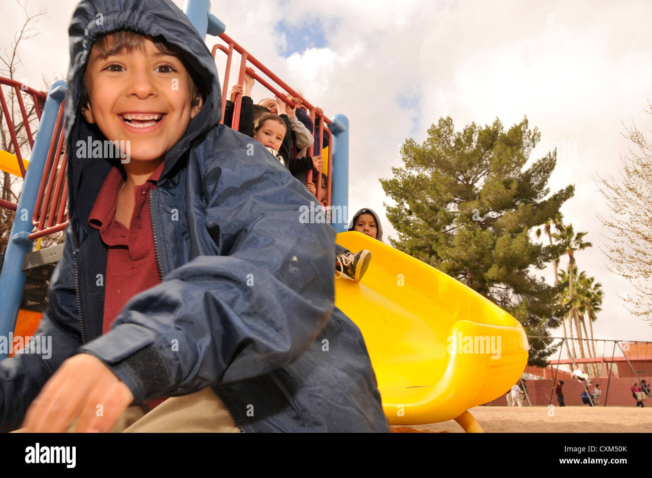 Elementary school kindergarteners play outside at recess in Tucson ...