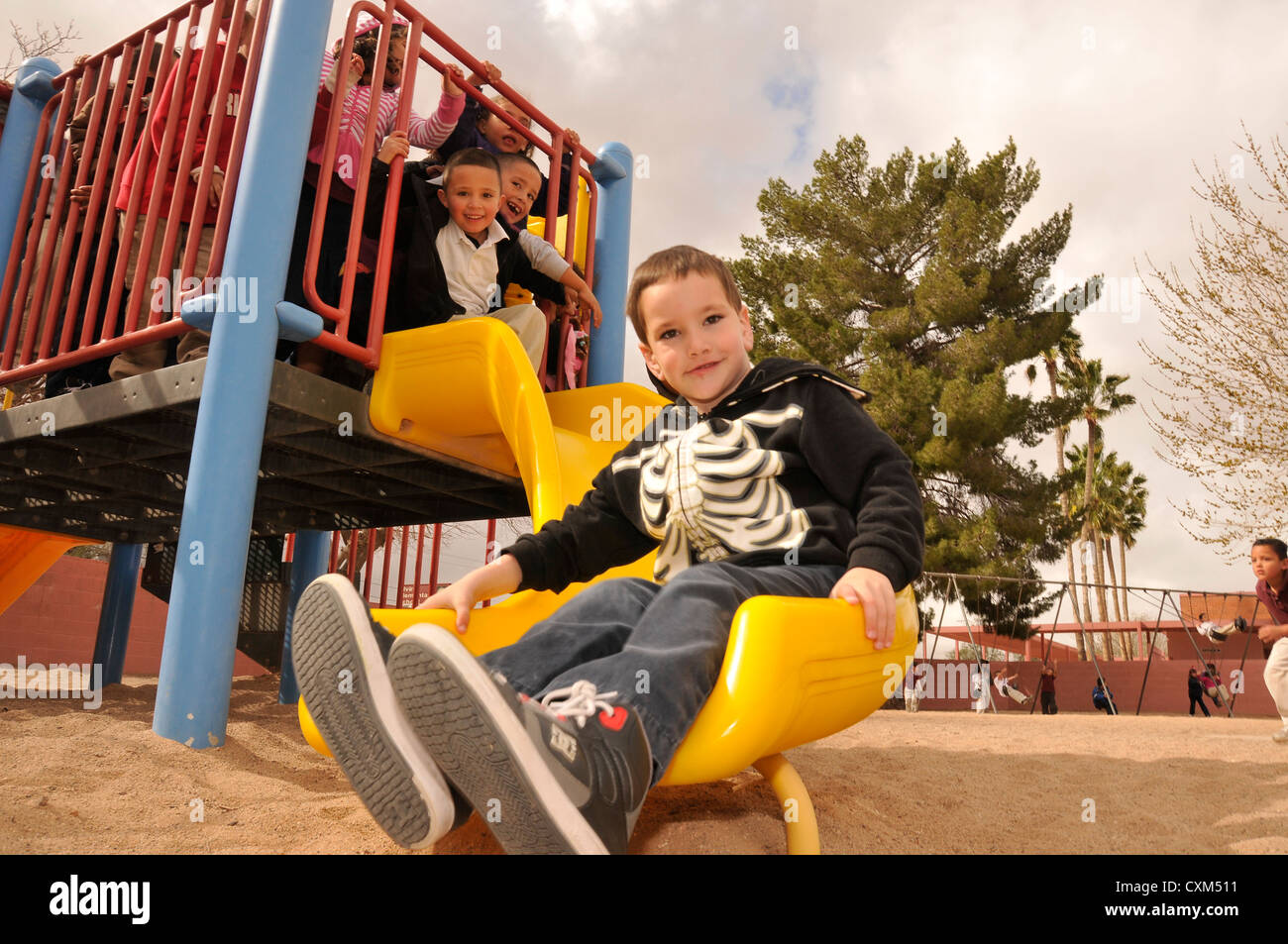 Elementary school kindergarteners play outside at recess in Tucson ...