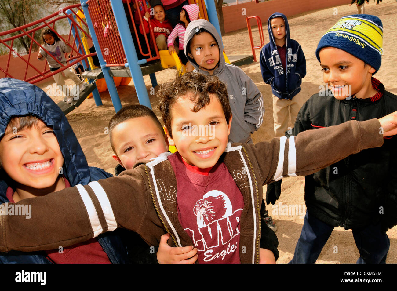 Elementary school kindergarteners play outside at recess in Tucson ...