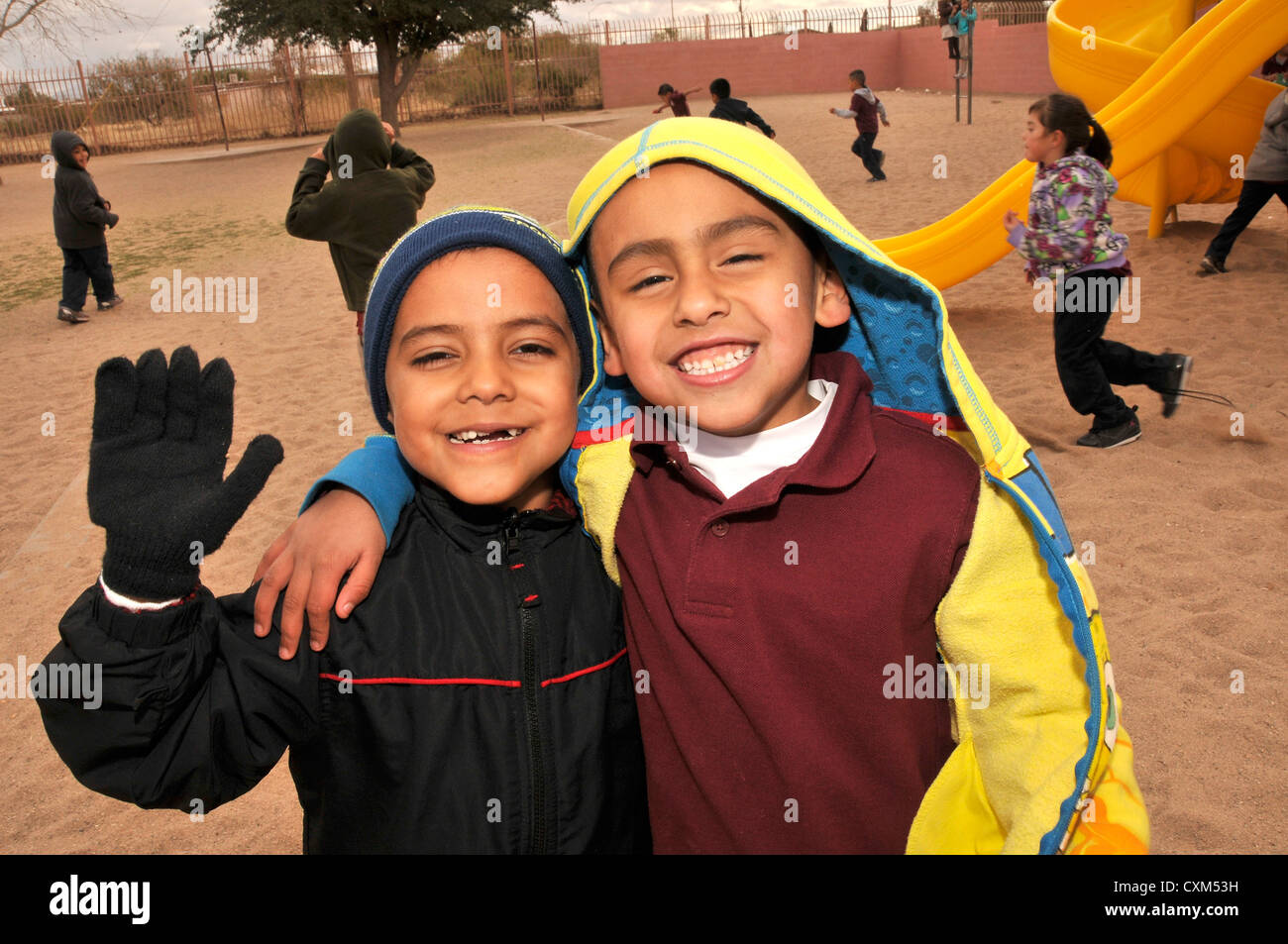 Elementary school kindergarteners play outside at recess in Tucson ...