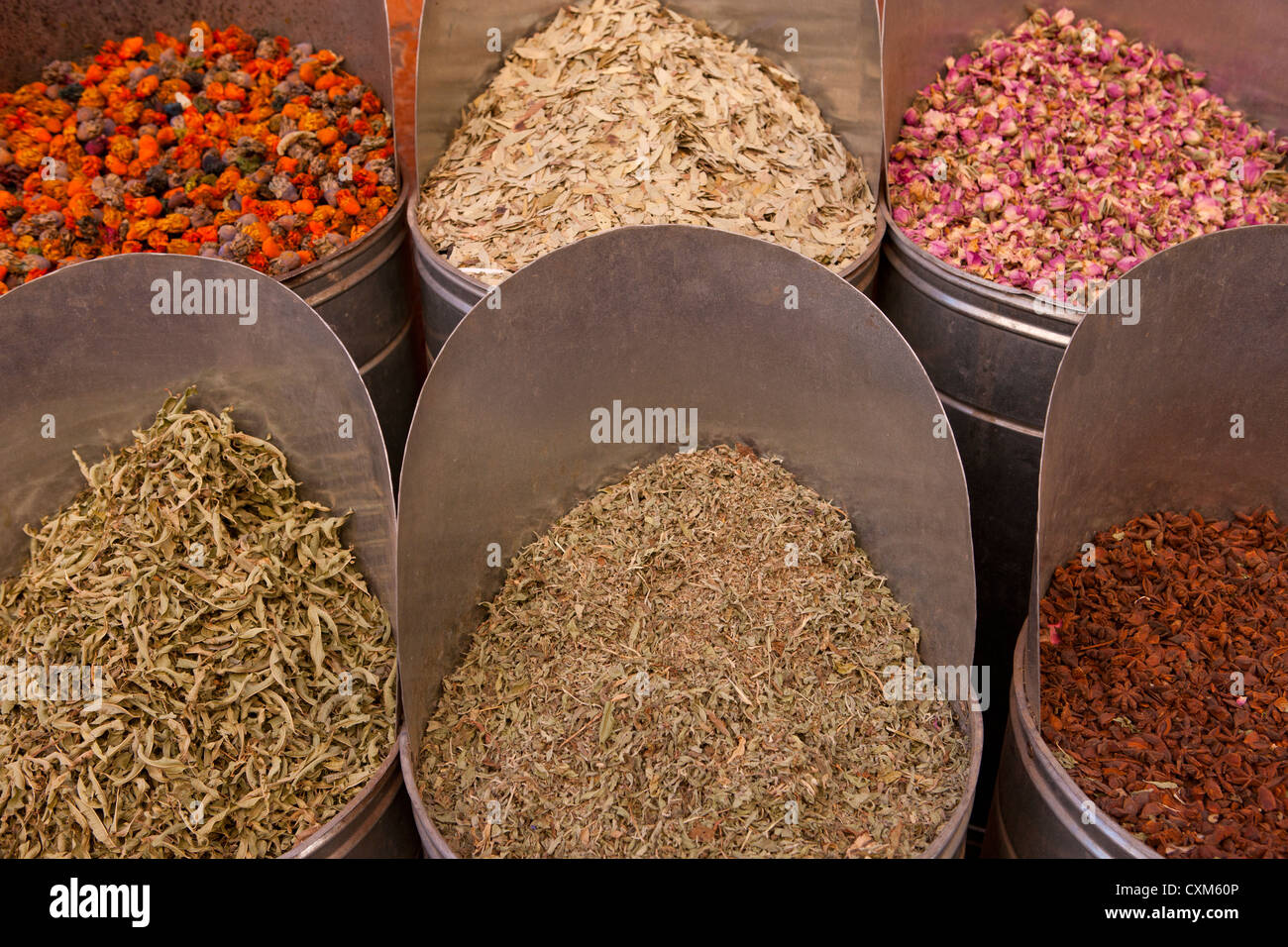 Display of metal buckets with herbs, spices and dried flowers ...