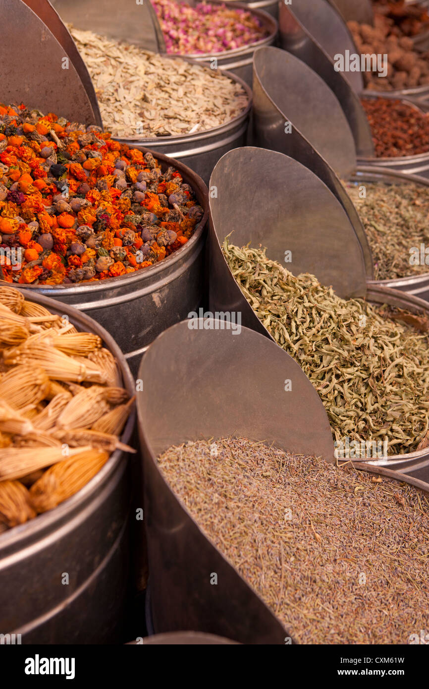 Metal buckets with dried rose buds, herbs and spices, Marrakech ...