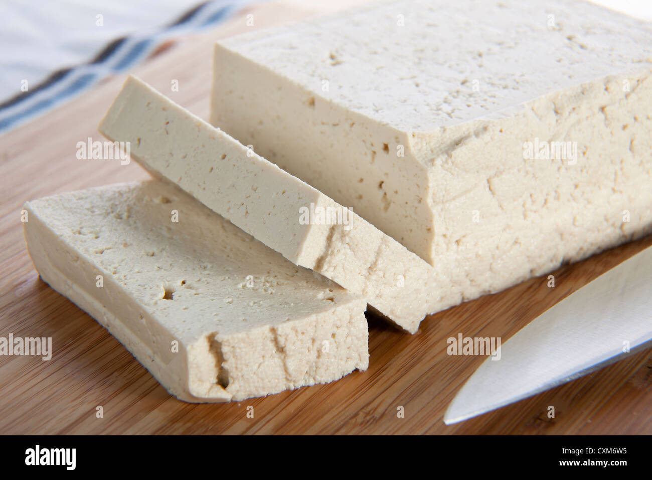 Block of fresh tofu on cutting block Stock Photo - Alamy