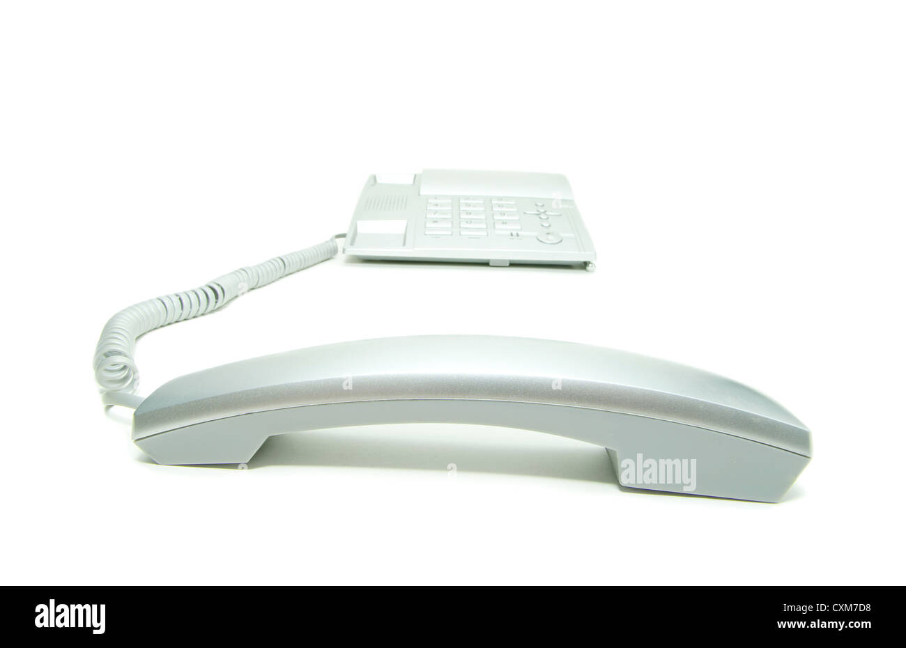 grey office telephone on a white background Stock Photo - Alamy