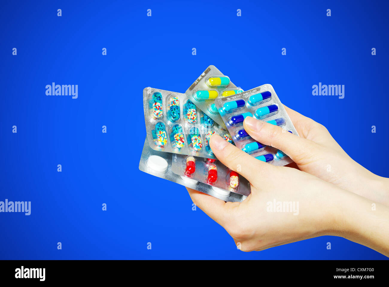 White and blue capsules hi-res stock photography and images - Alamy