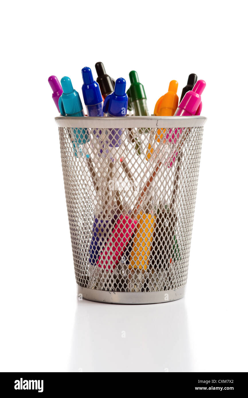 a background of desk top pen holder full of brightly colored pens on a ...