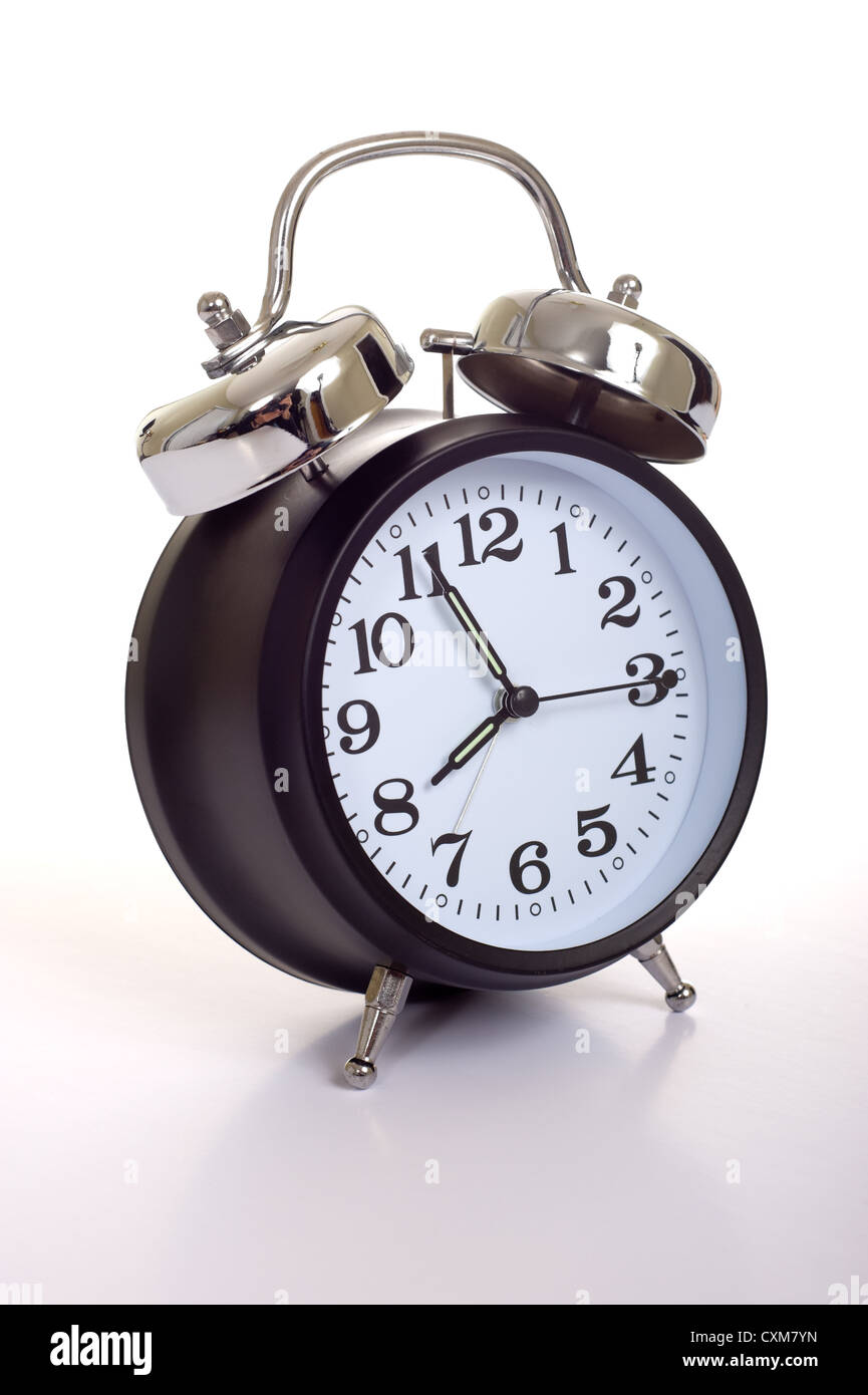 Black alarm clock on a white background Stock Photo - Alamy
