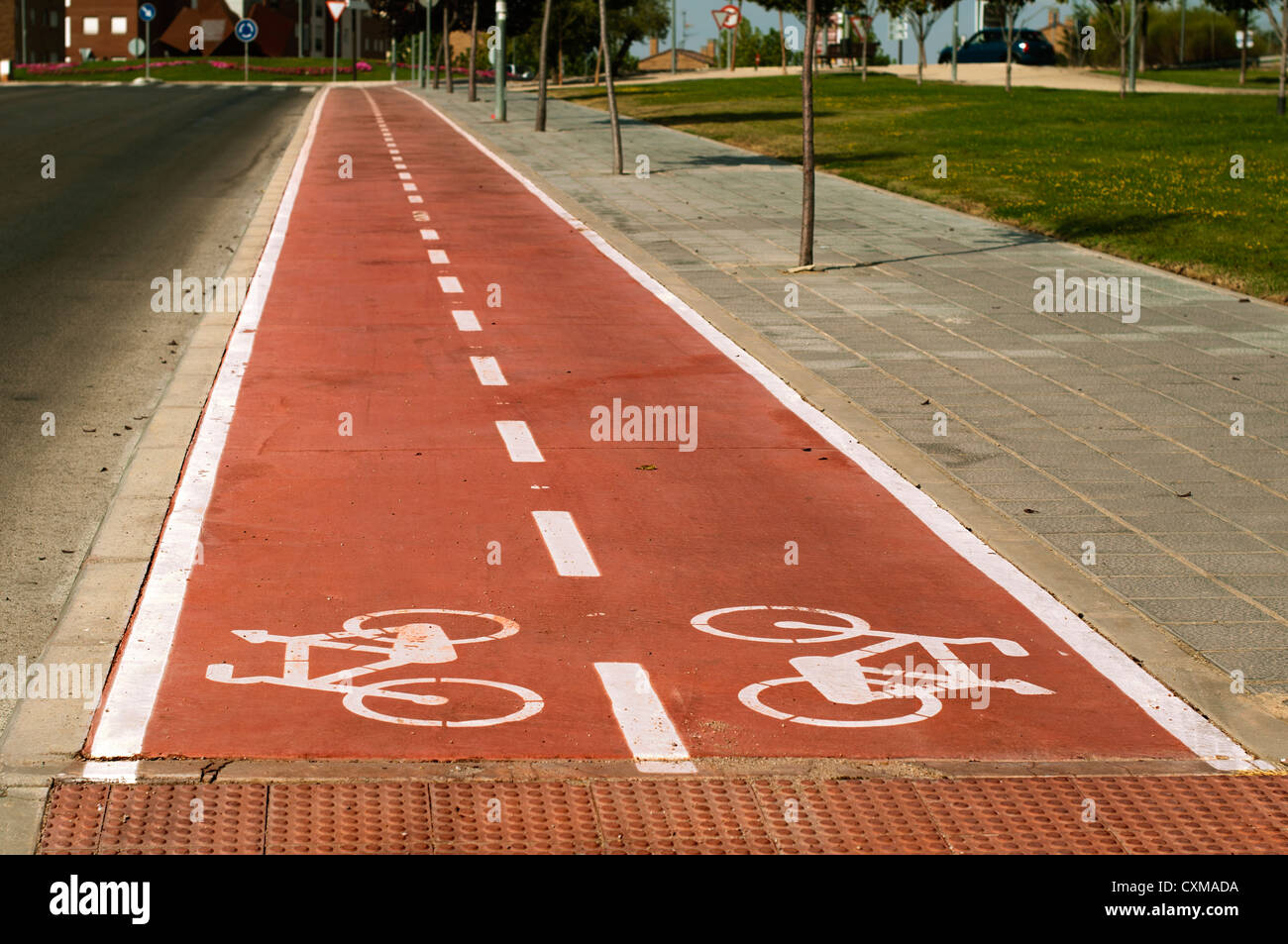 Red bike lanes and symbols Stock Photo - Alamy