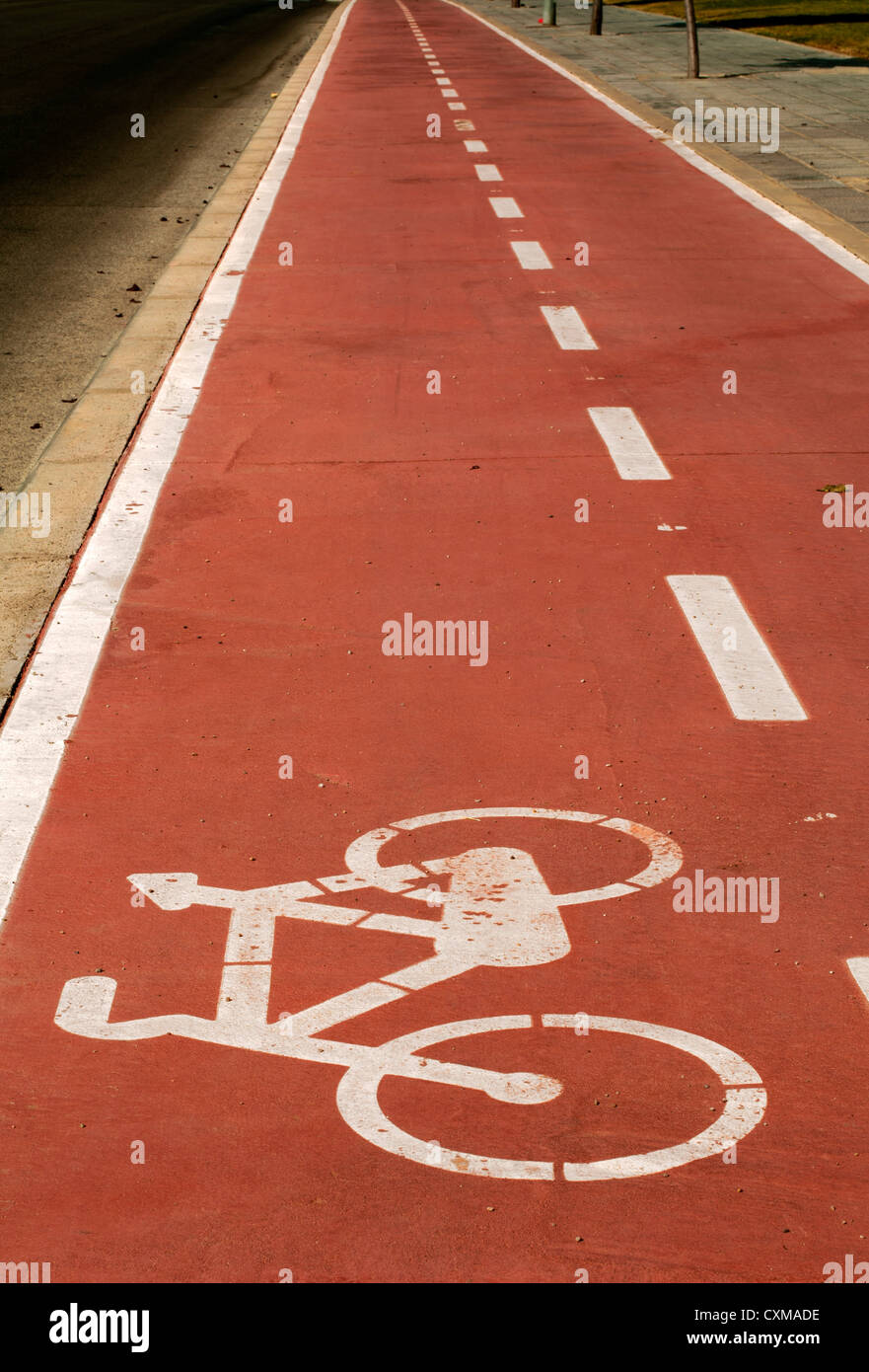 Red bike lanes and symbols Stock Photo - Alamy