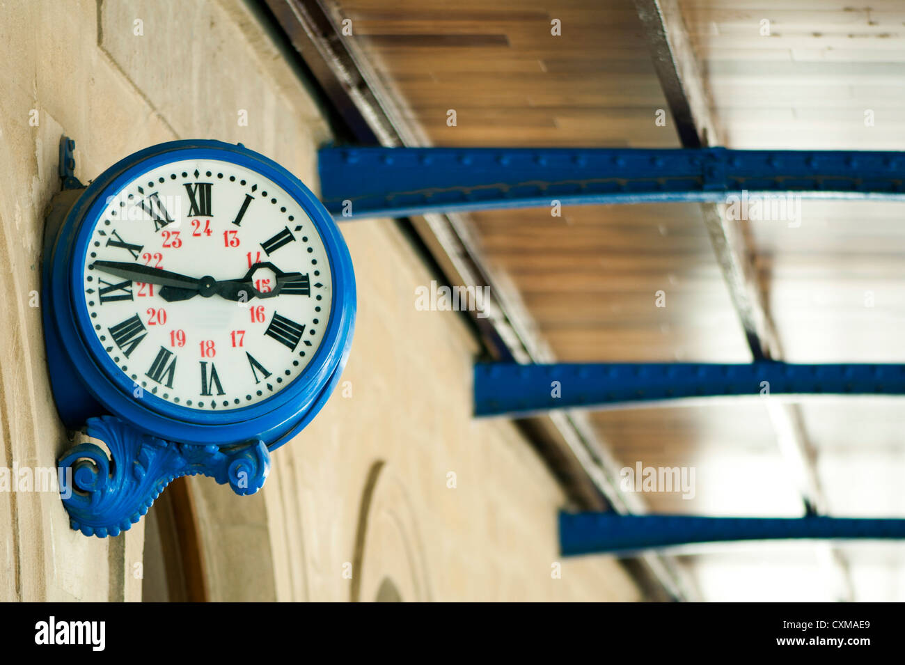 Antique external blue clock on railway station Stock Photo - Alamy