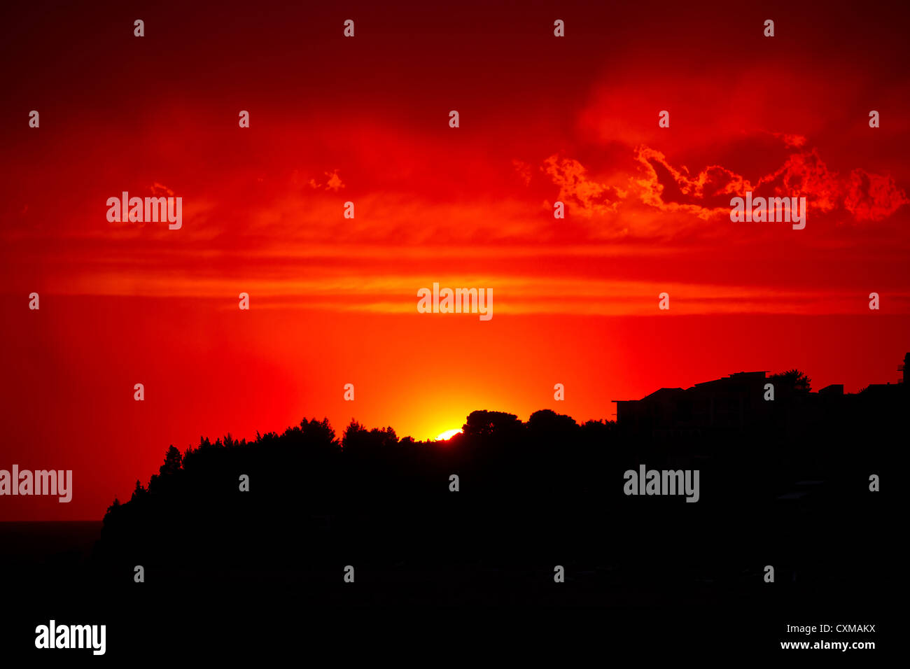 Red sunset sky with dramatic clouds Stock Photo - Alamy