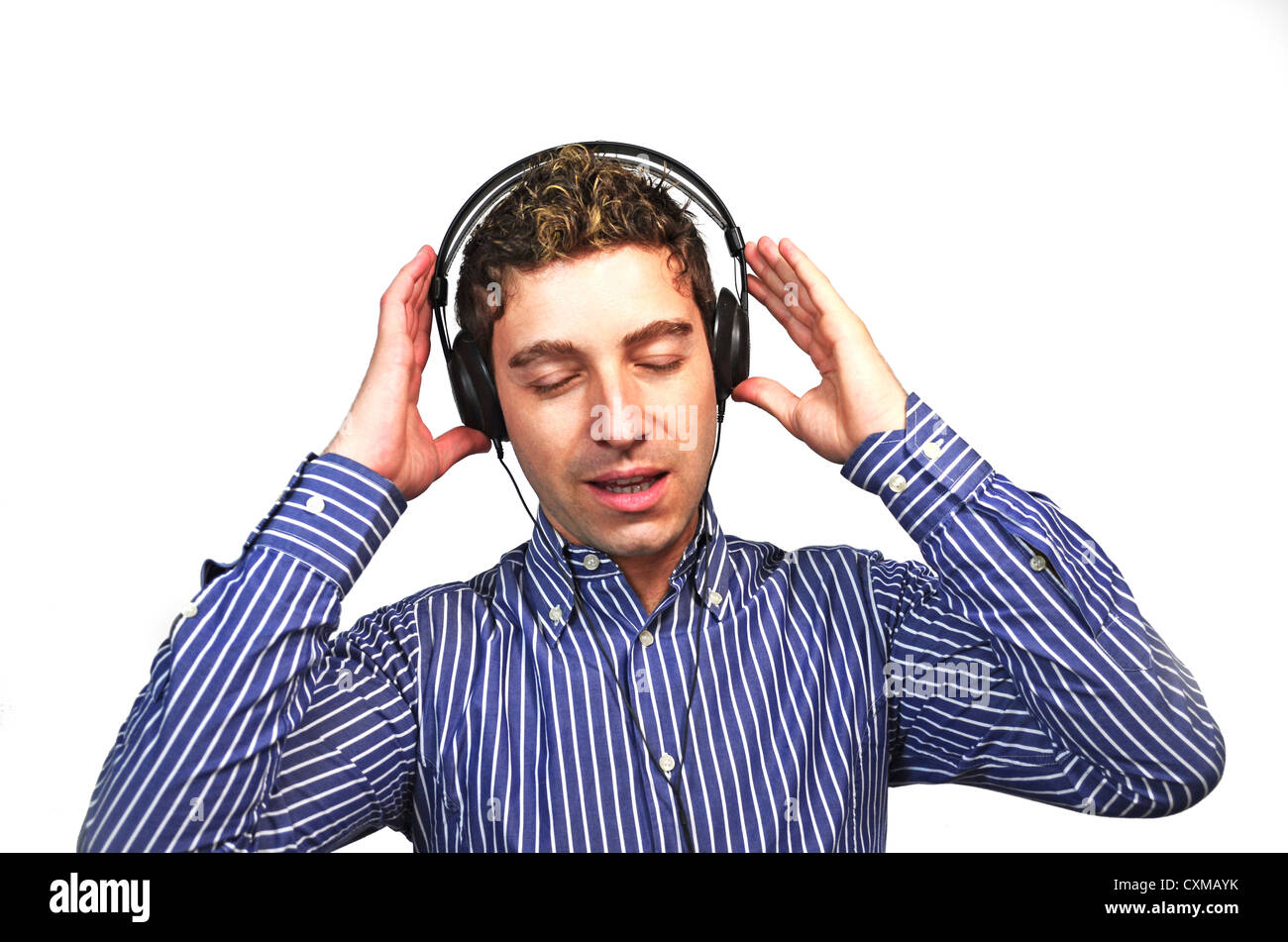 One guy singing while holding his headset with his hands, eyes closed ...