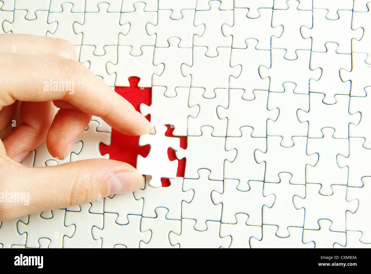 Hands doing puzzle hi-res stock photography and images - Alamy