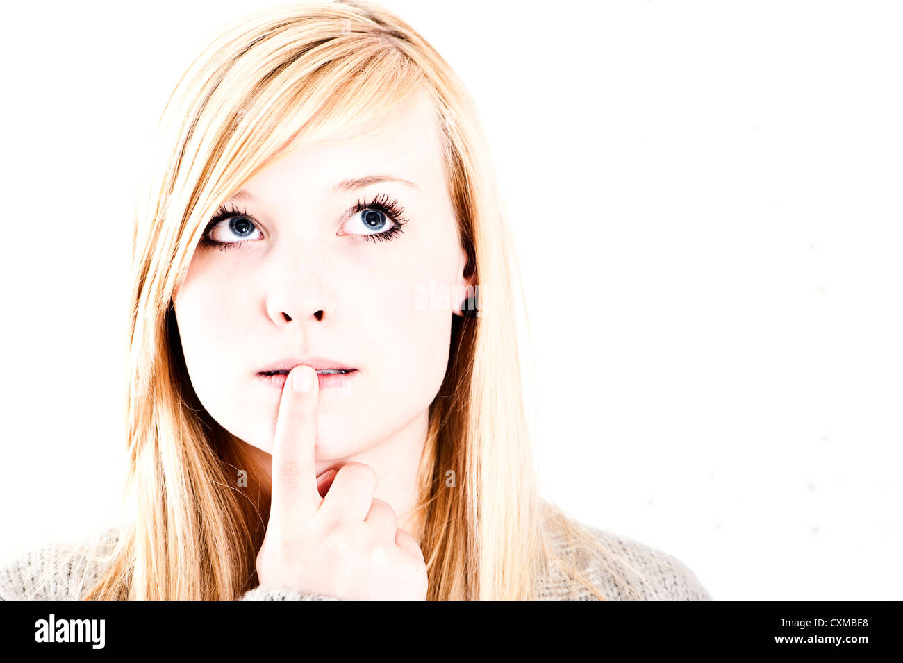 Young woman is thinking Stock Photo - Alamy