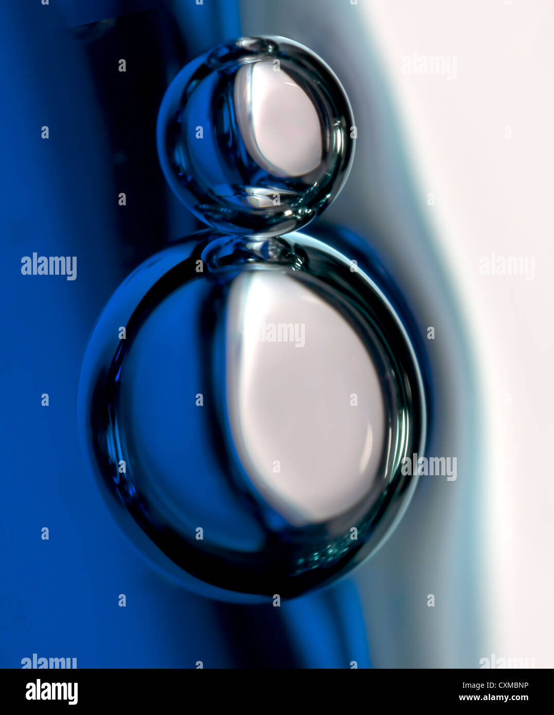 two bubbles in a blue liquid Stock Photo - Alamy