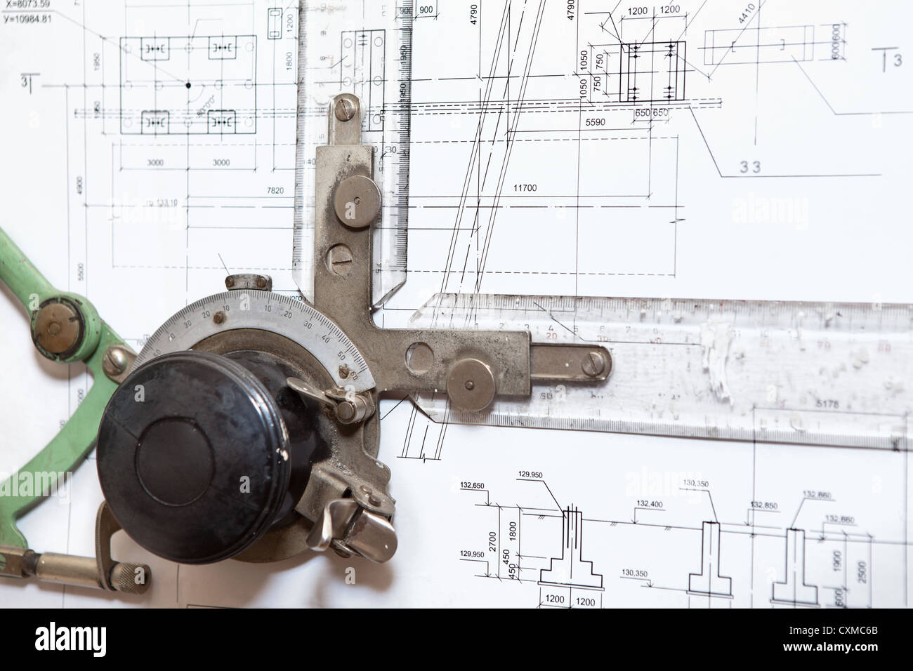 Ruler instrument of drawing board on engineering blueprint. Close-up ...