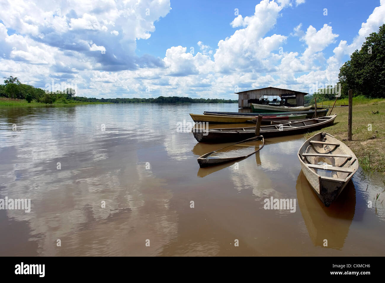 Amazon river native community boat pear Stock Photo - Alamy