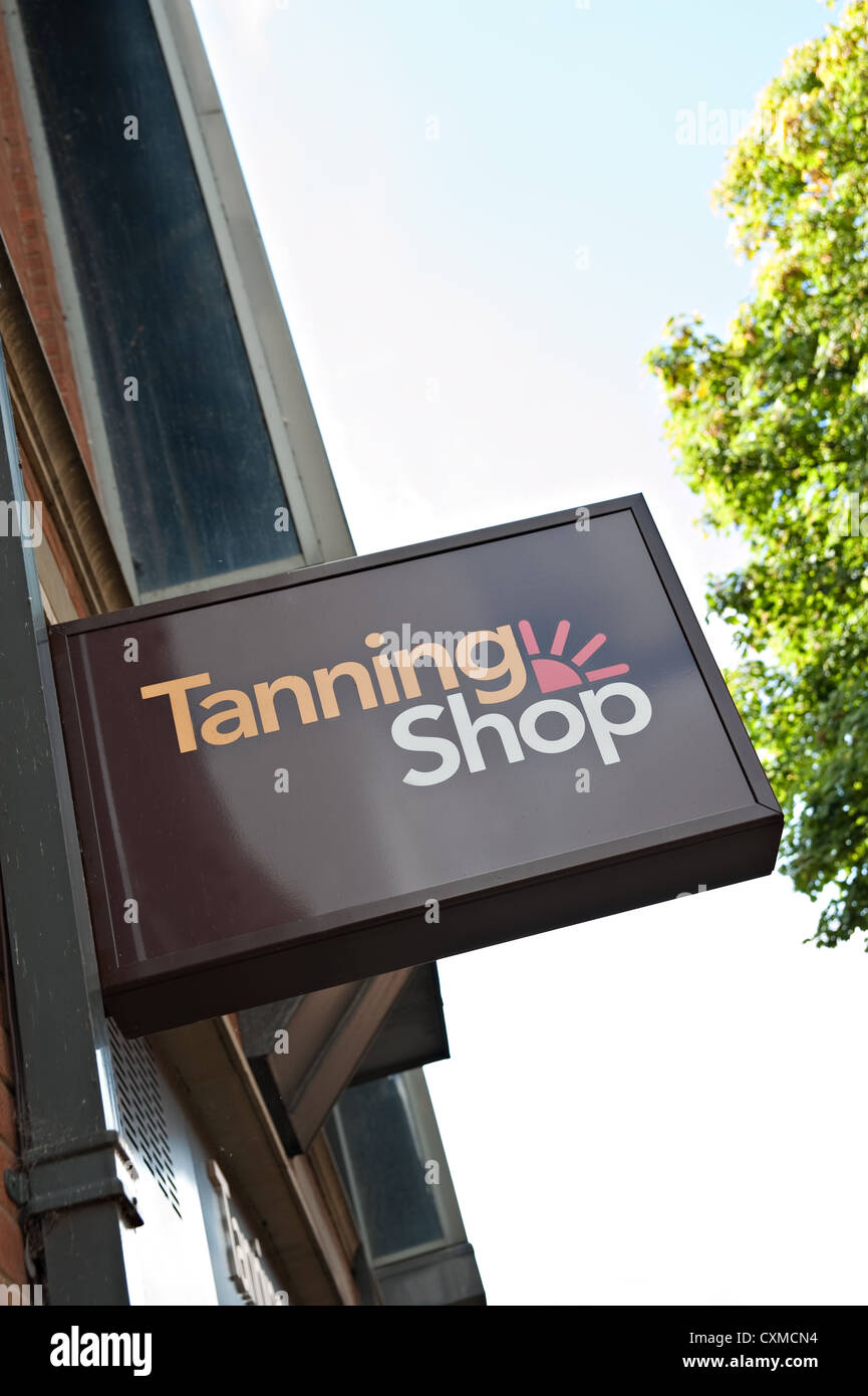 A Tanning Shop Sign Stock Photo - Alamy