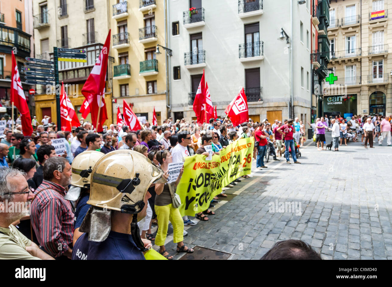 Laid off government worker officials protest in the streets of Pamplona ...