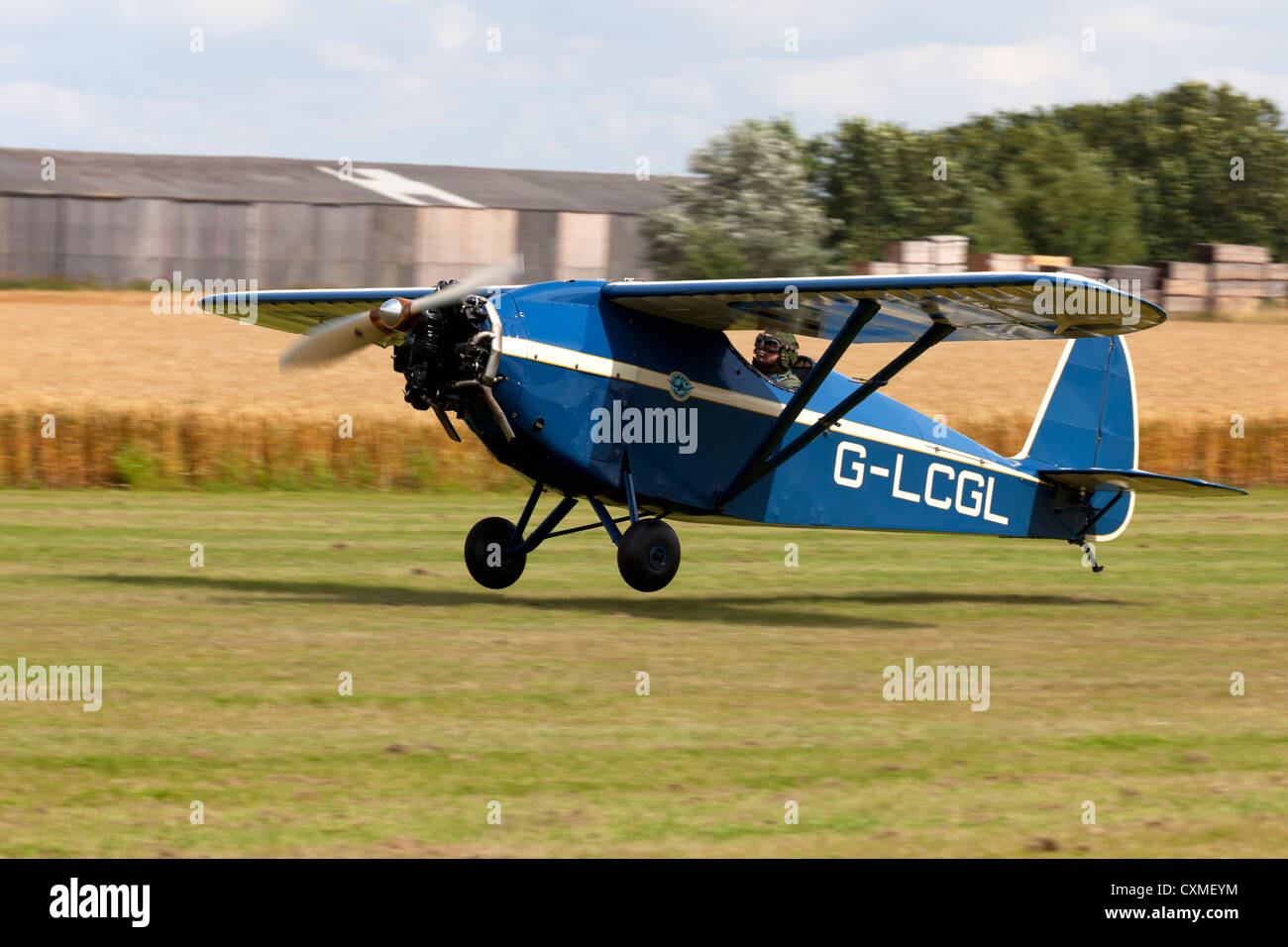Comper CLA7 Swift Replica G-LCGL landing on grass runway Stock Photo ...