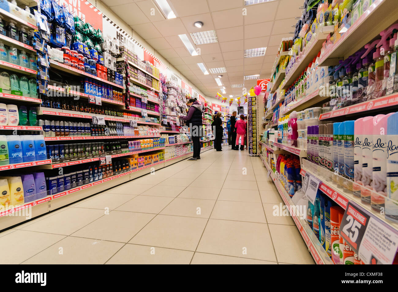 Customer s browse products on shelves in a Poundland shop store Stock ...