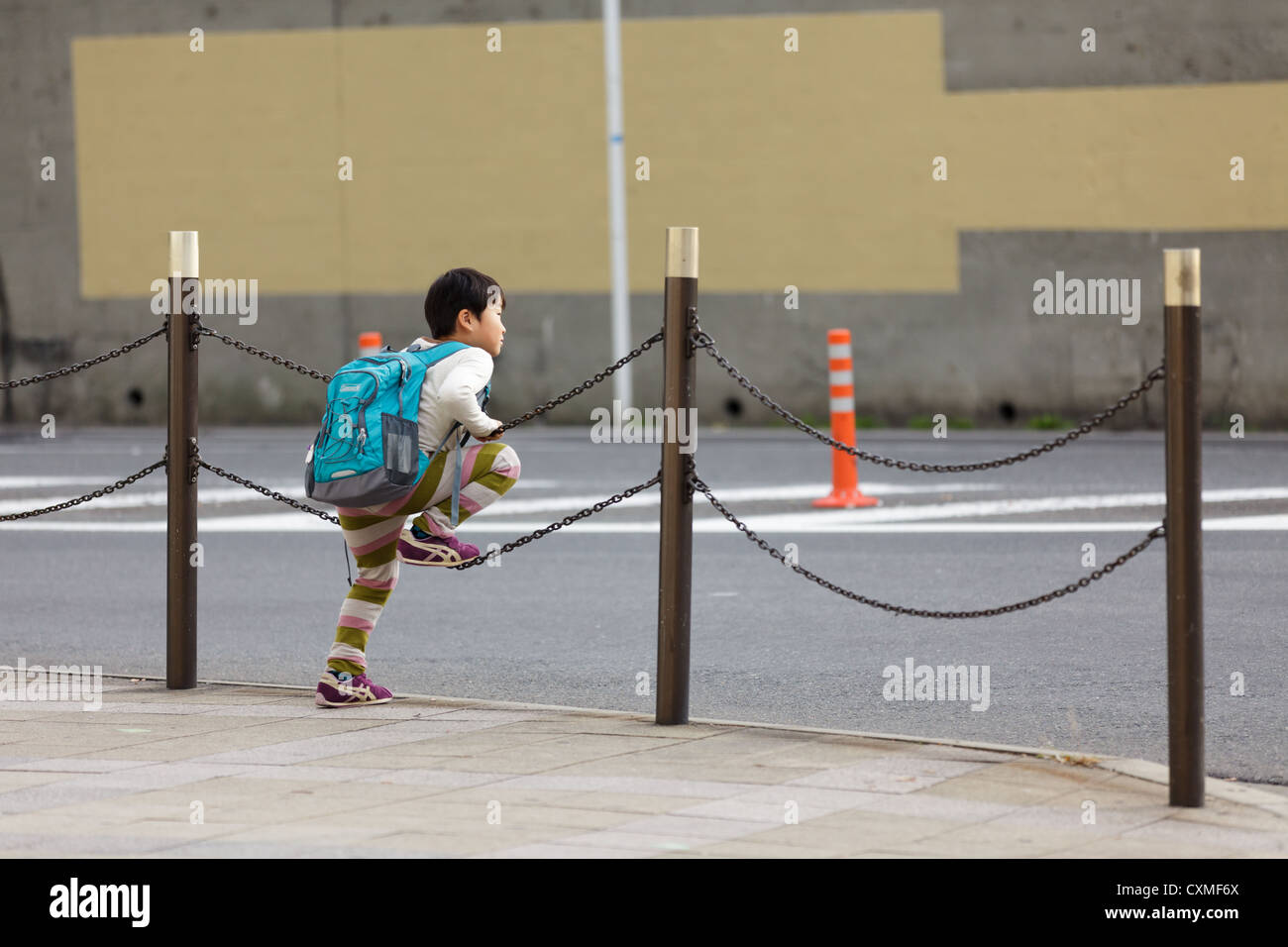 Japanses boy after school waiting in Osaka street, Japan Stock Photo ...